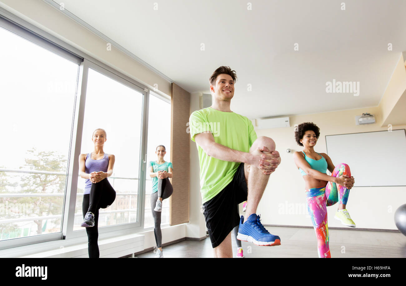 group of smiling people exercising in gym Stock Photo - Alamy