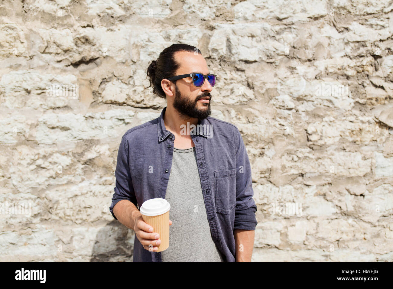 man drinking coffee from paper cup on street Stock Photo - Alamy