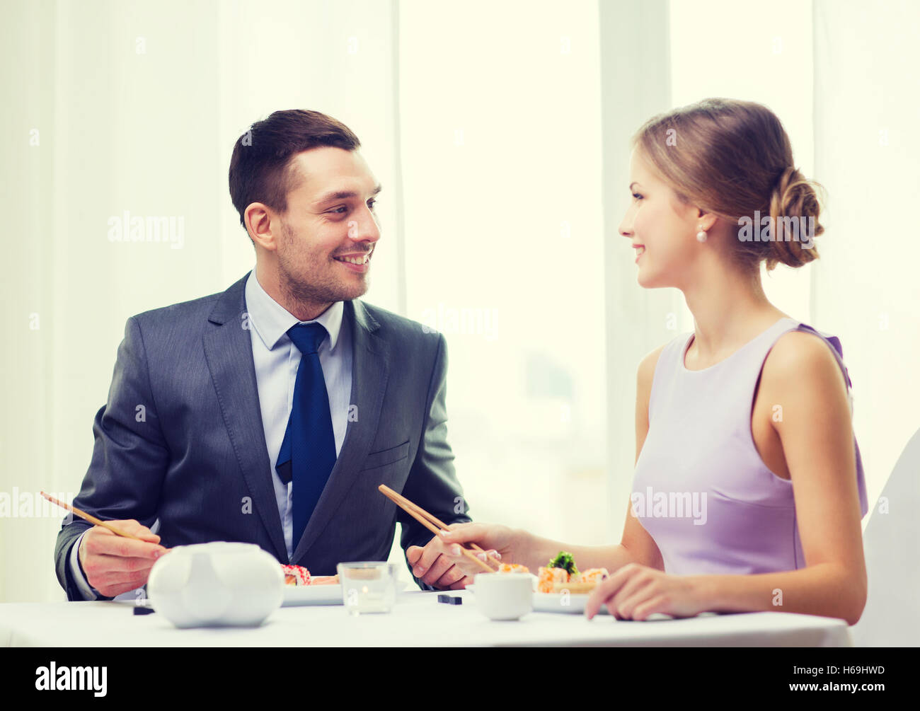 Couple eating at restaurant hi-res stock photography and images - Alamy