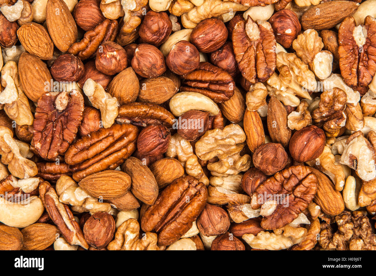 Mix of different nuts closeup photo Stock Photo - Alamy