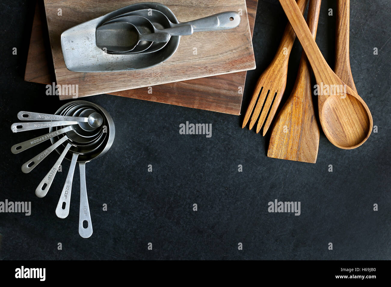 A collection of vintage baking and cooking supplies, wood cutting ...