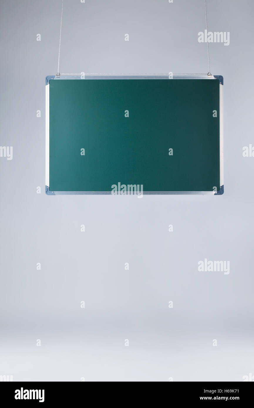 green blackboard on bright background Stock Photo - Alamy