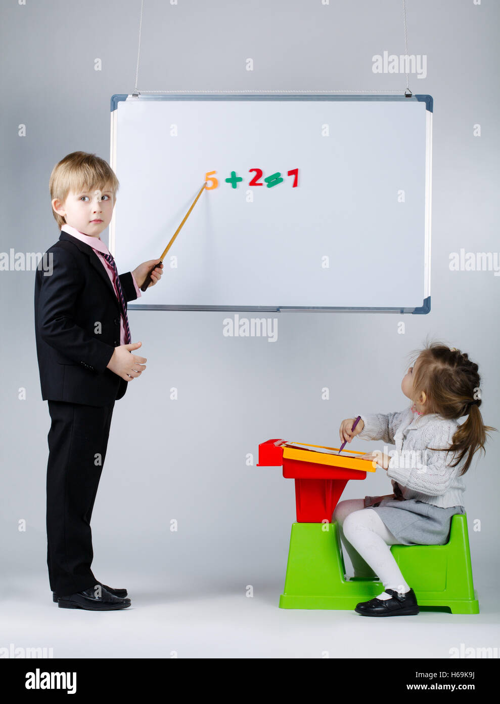 young boy teaching sister Stock Photo - Alamy