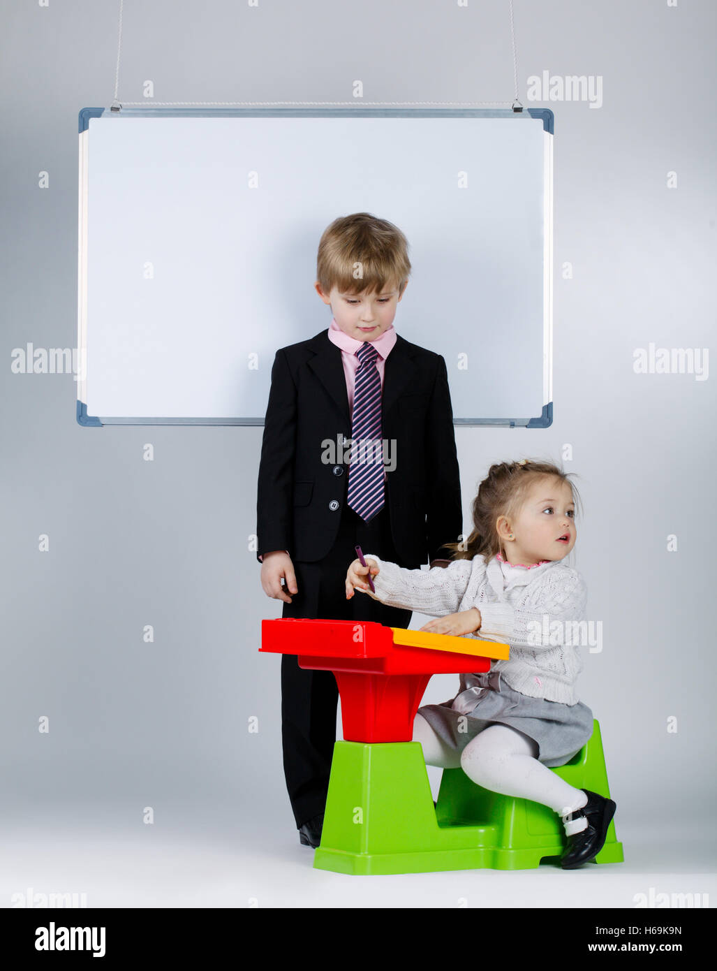 young boy teaching sister Stock Photo - Alamy