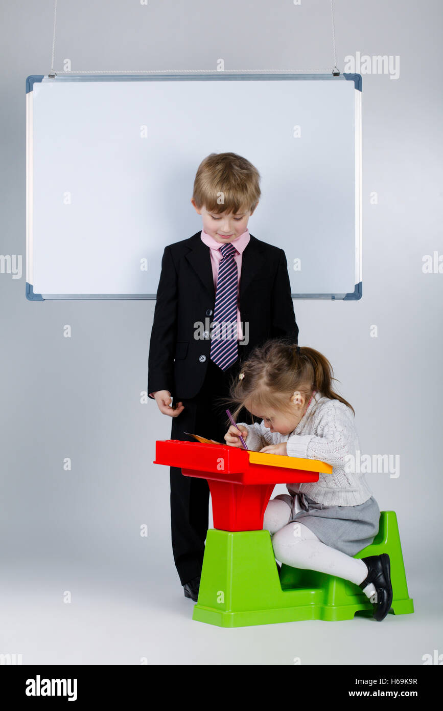 young boy teaching sister Stock Photo - Alamy