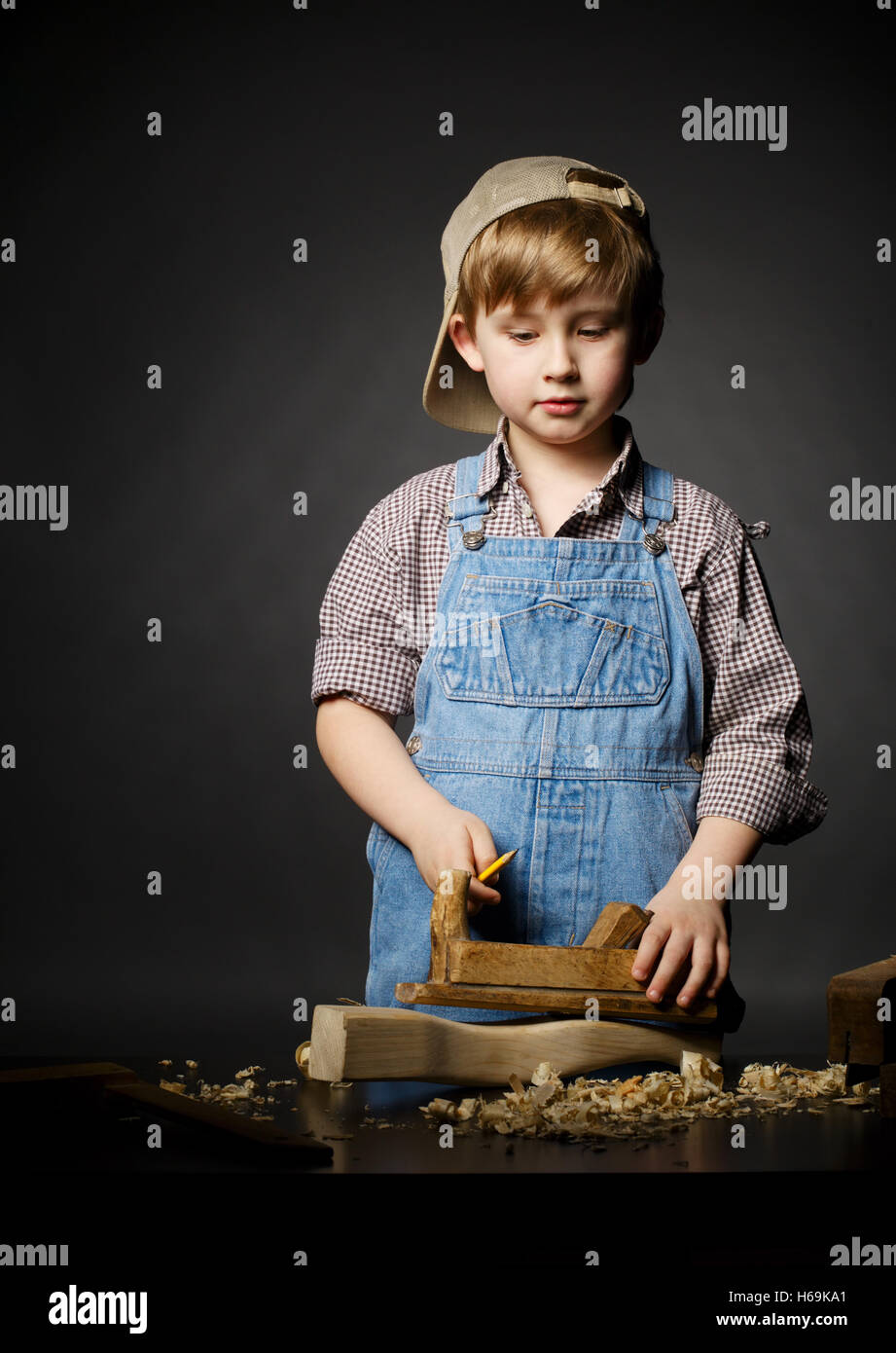 little boy working with plane Stock Photo - Alamy