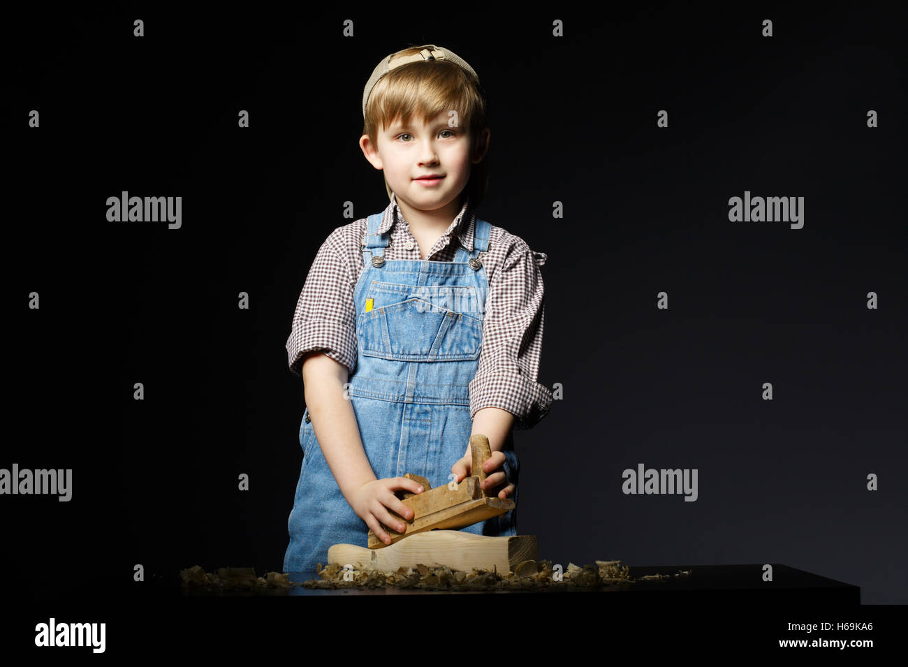 little boy working with plane Stock Photo - Alamy