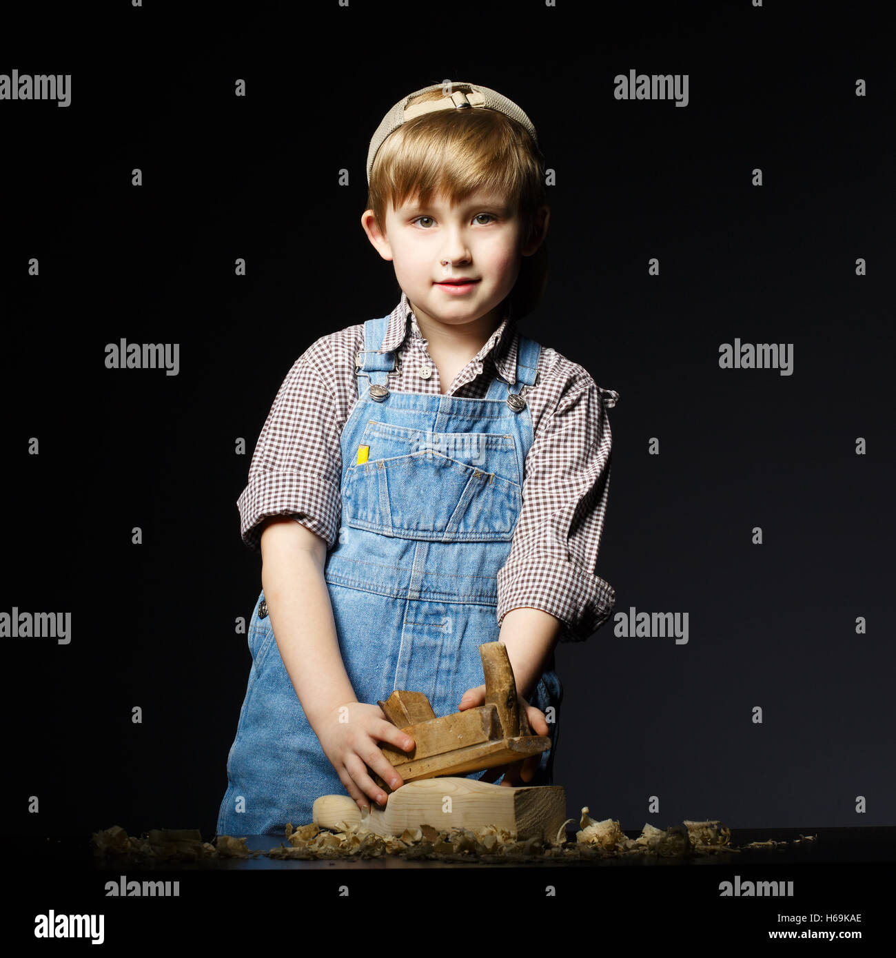 little boy working with plane Stock Photo - Alamy