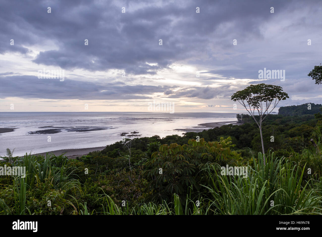 peaceful sunset scene with clouds above the pacific ocean in Uvita ...