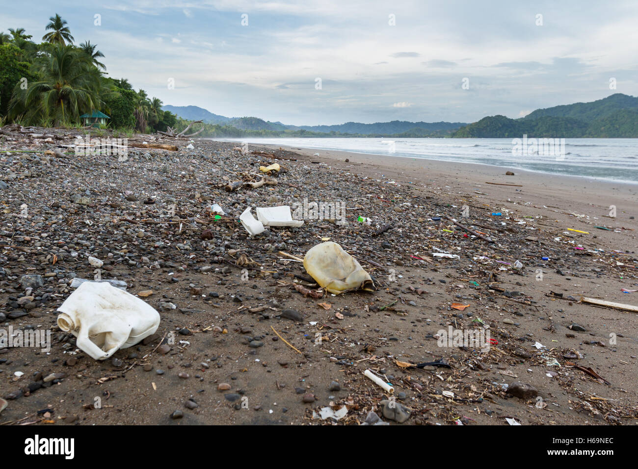 sad scene of environmental awareness of a beach full of trash after a ...