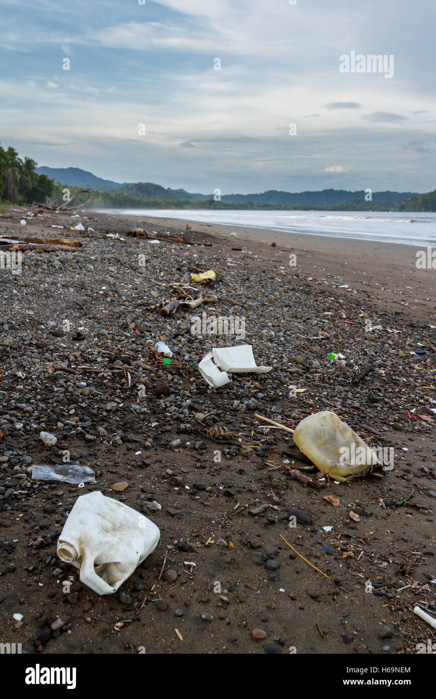 sad scene of environmental awareness of a beach full of trash after a ...