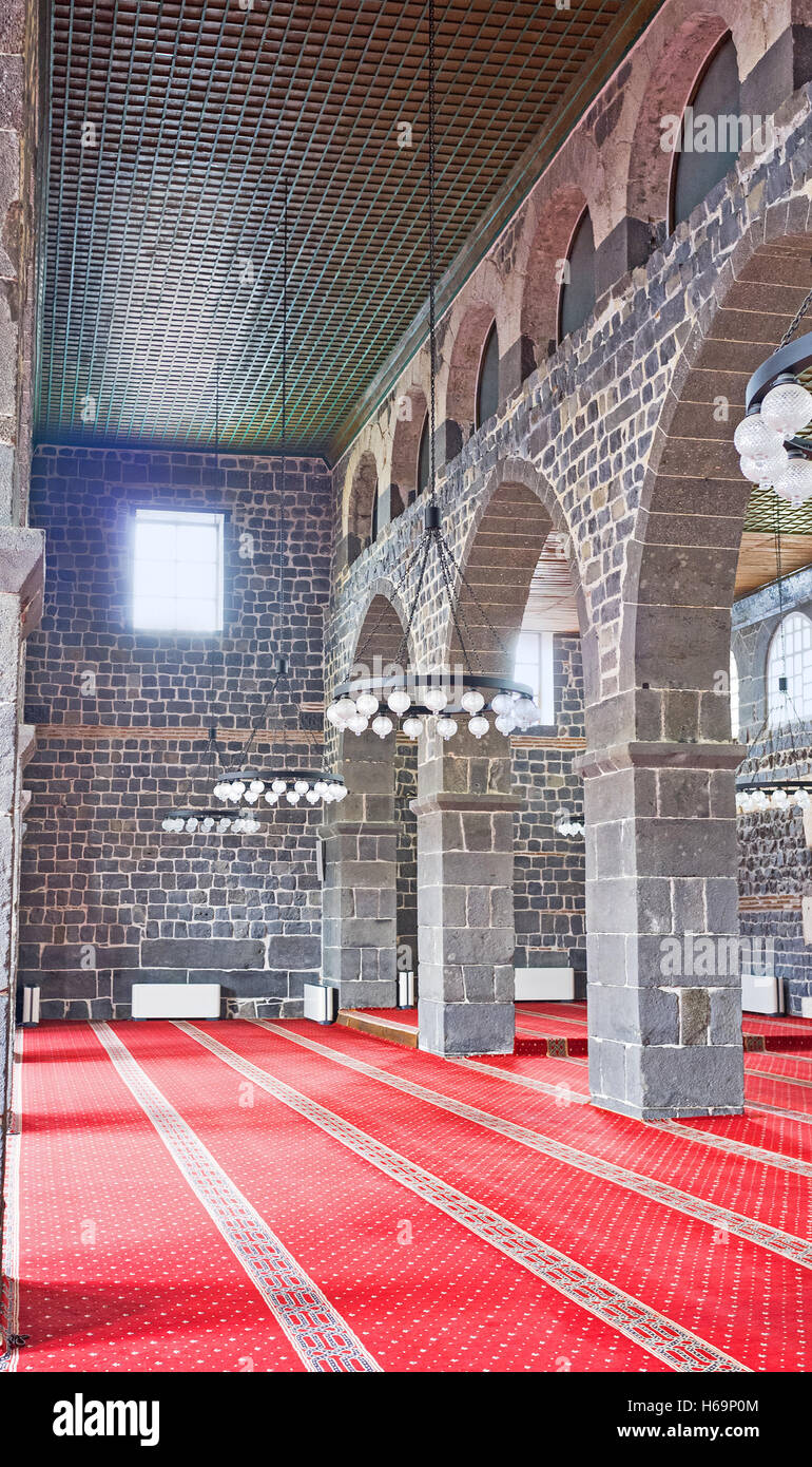 The interior of the Great Mosque decorated with the arches of black ...