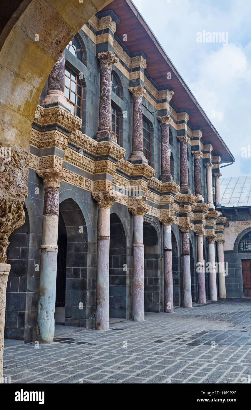 The black basalt wall of the portico of the Great Mosque decorated with ...