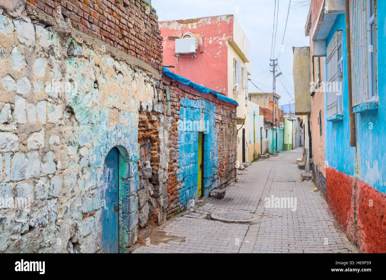 The poor residential neighborhood boasts the colorful houses and fences ...