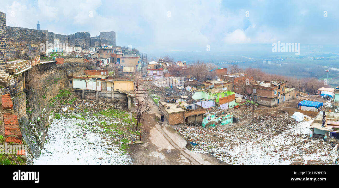 The tiny houses and slums on the slope outside the medieval town wall ...