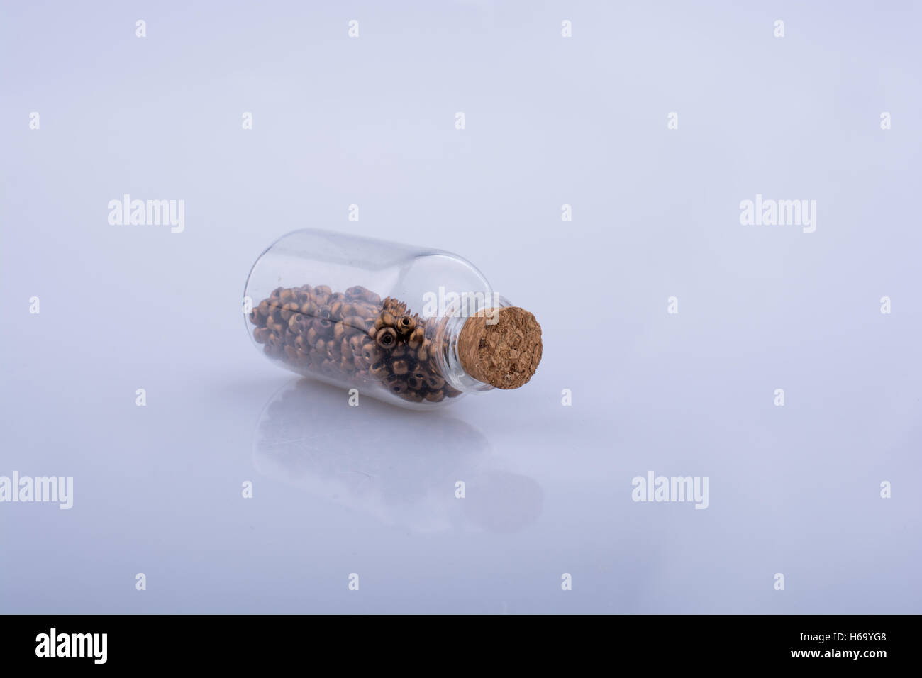 Little perfume glass bottle on a white background Stock Photo - Alamy