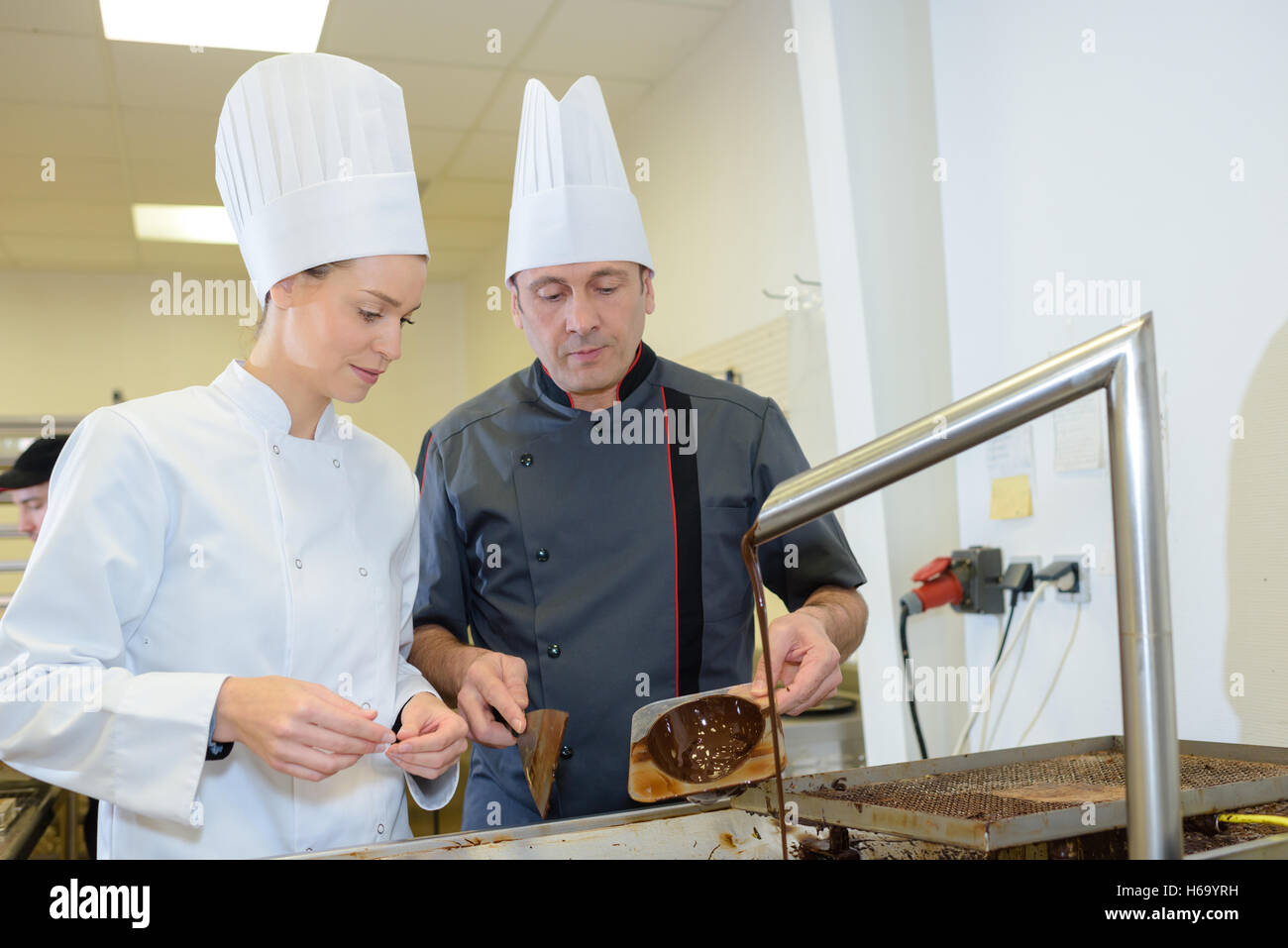 cheerful young chefs professional pastry cook at work Stock Photo - Alamy