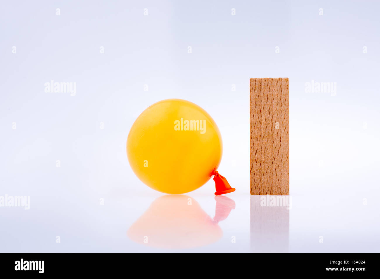 Balloon and domino pieces positioned on white background Stock Photo ...