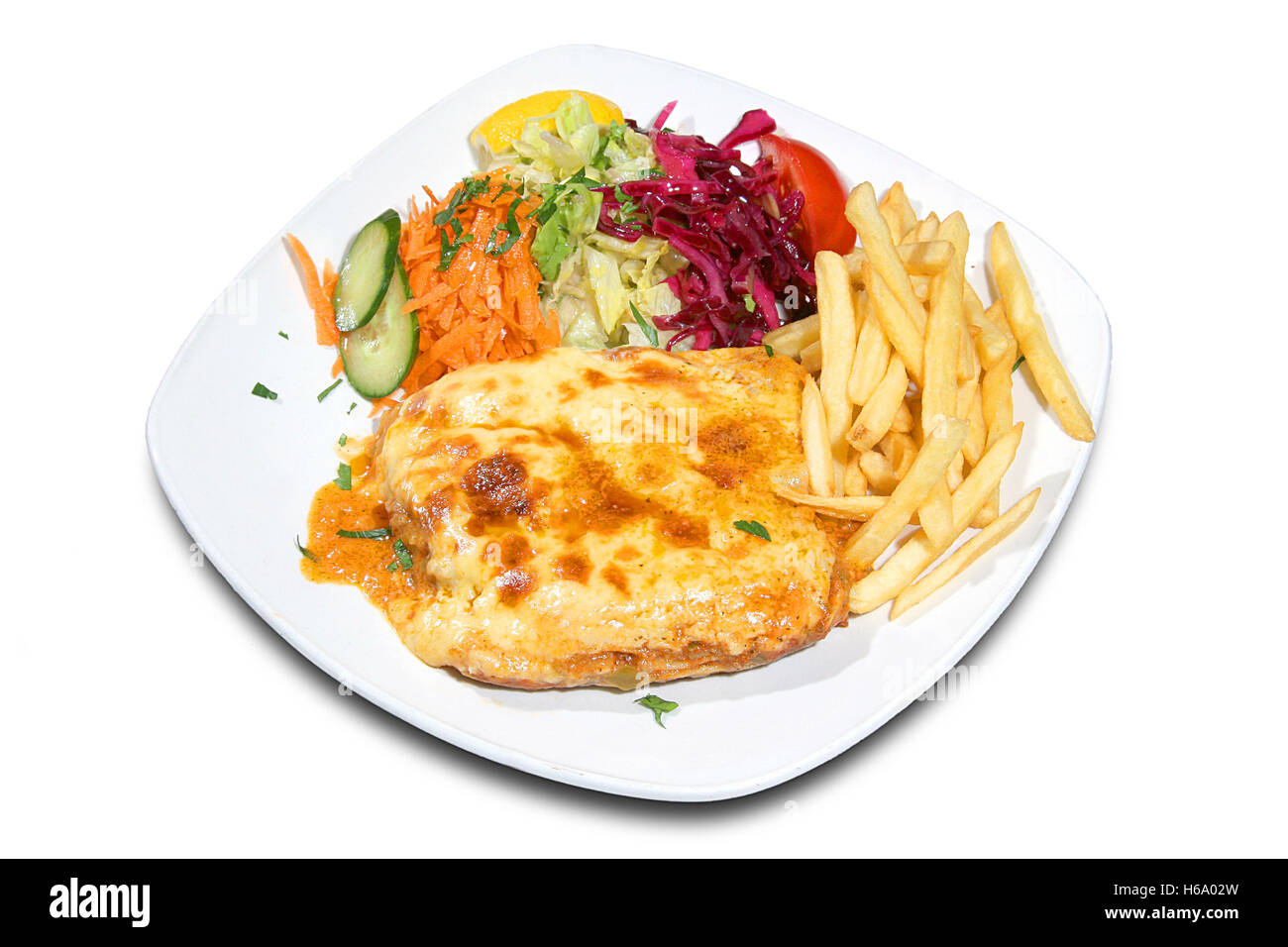Fresh Lasagna served with fries and salads Stock Photo - Alamy