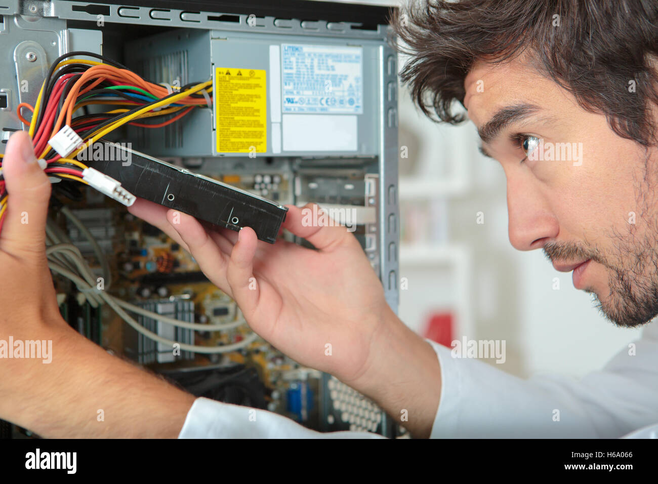 Man working on computer hardware Stock Photo - Alamy