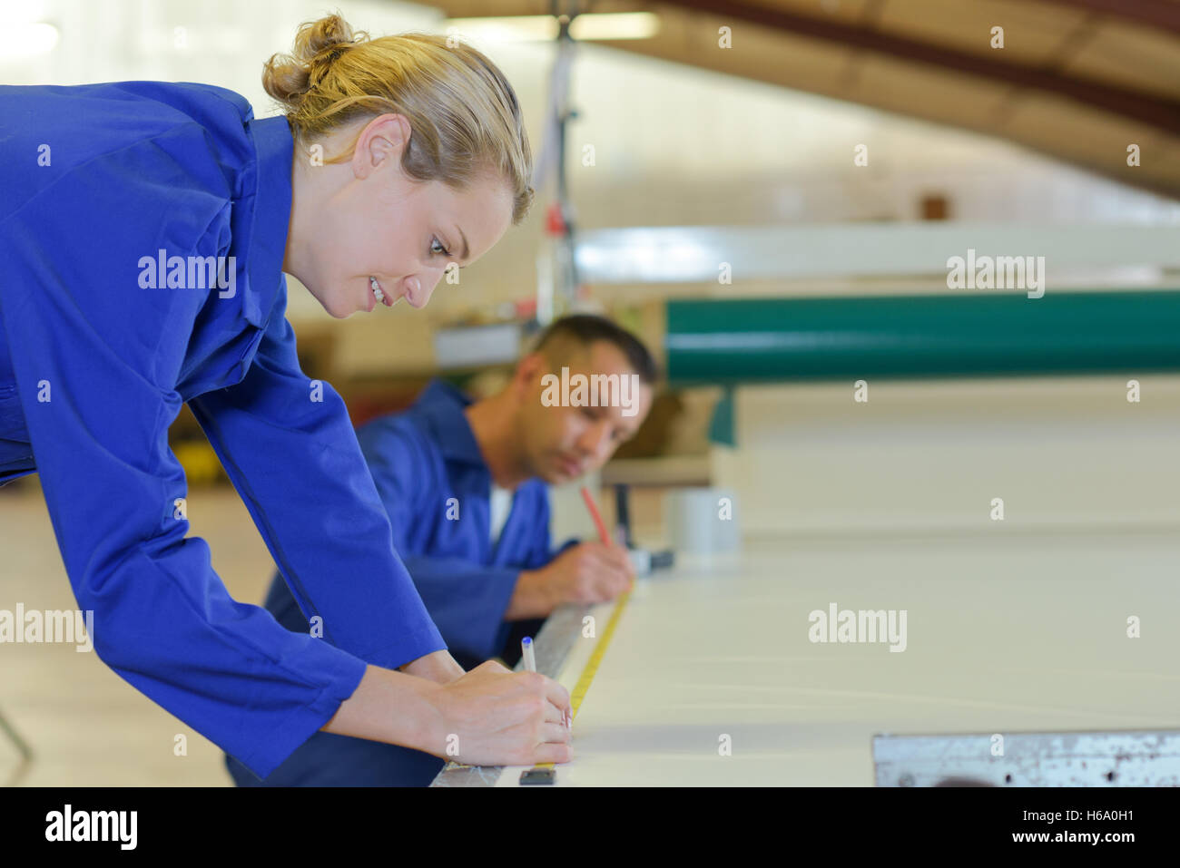 Worker marking measurement on hi-res stock photography and images - Alamy