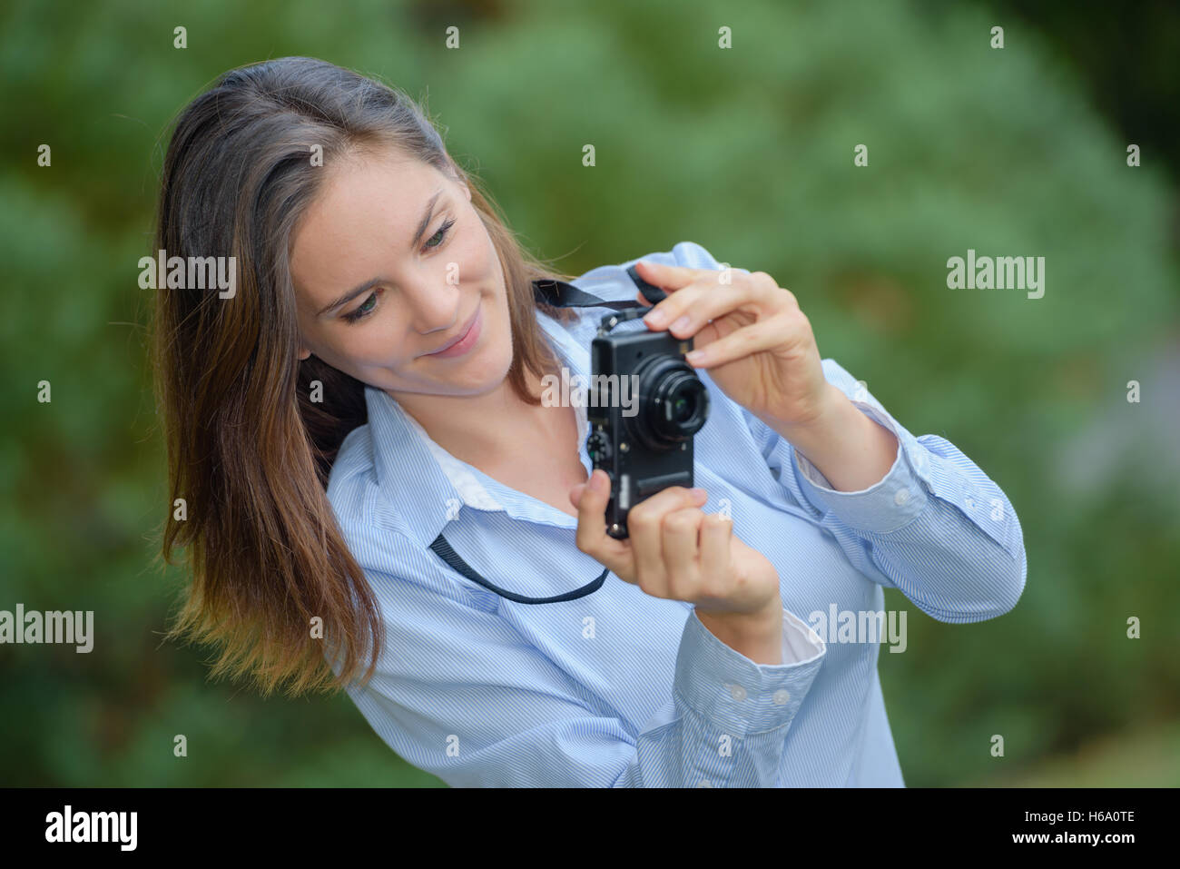 Young woman taking pictures trees hi-res stock photography and images ...