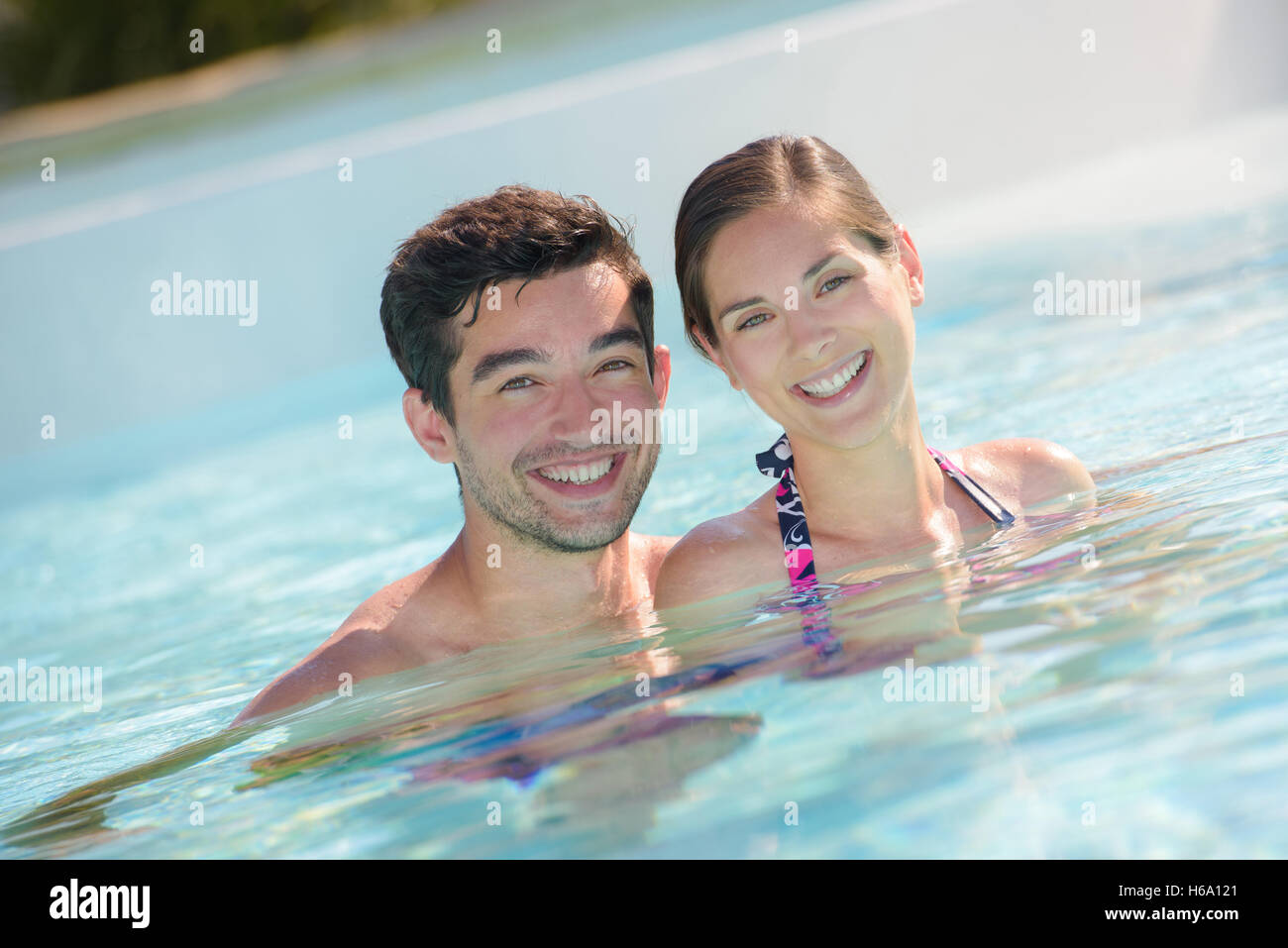 couple having a swim Stock Photo - Alamy