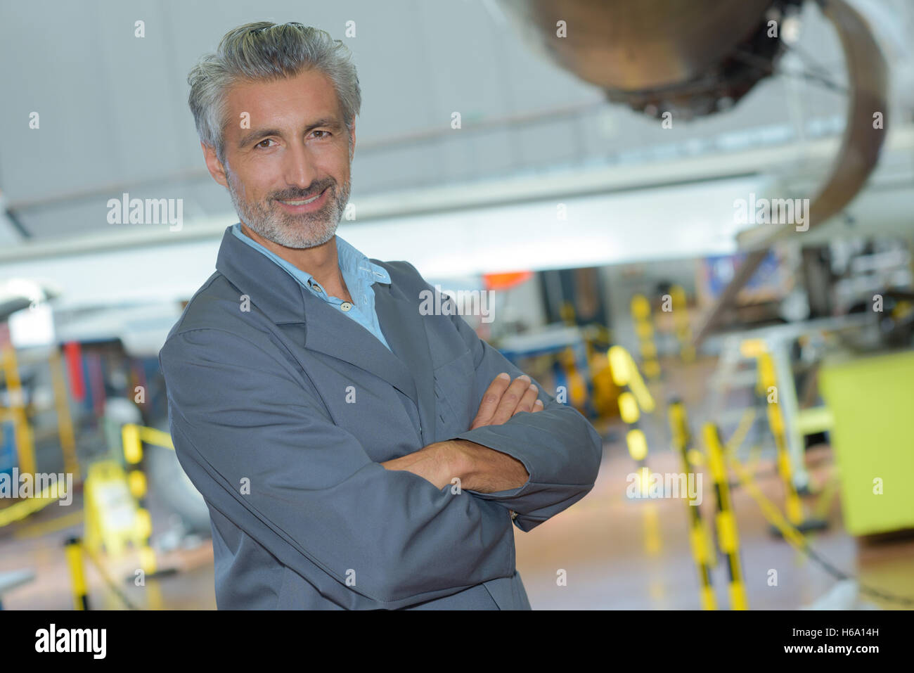 portrait of an aviation engineer in a hangar Stock Photo - Alamy