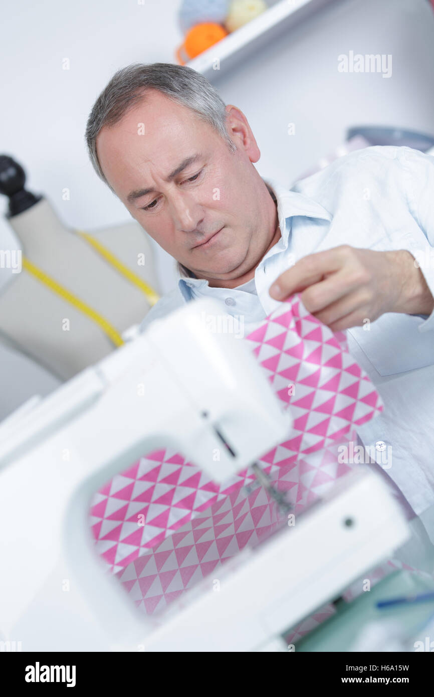 tailor with sewing machine Stock Photo - Alamy