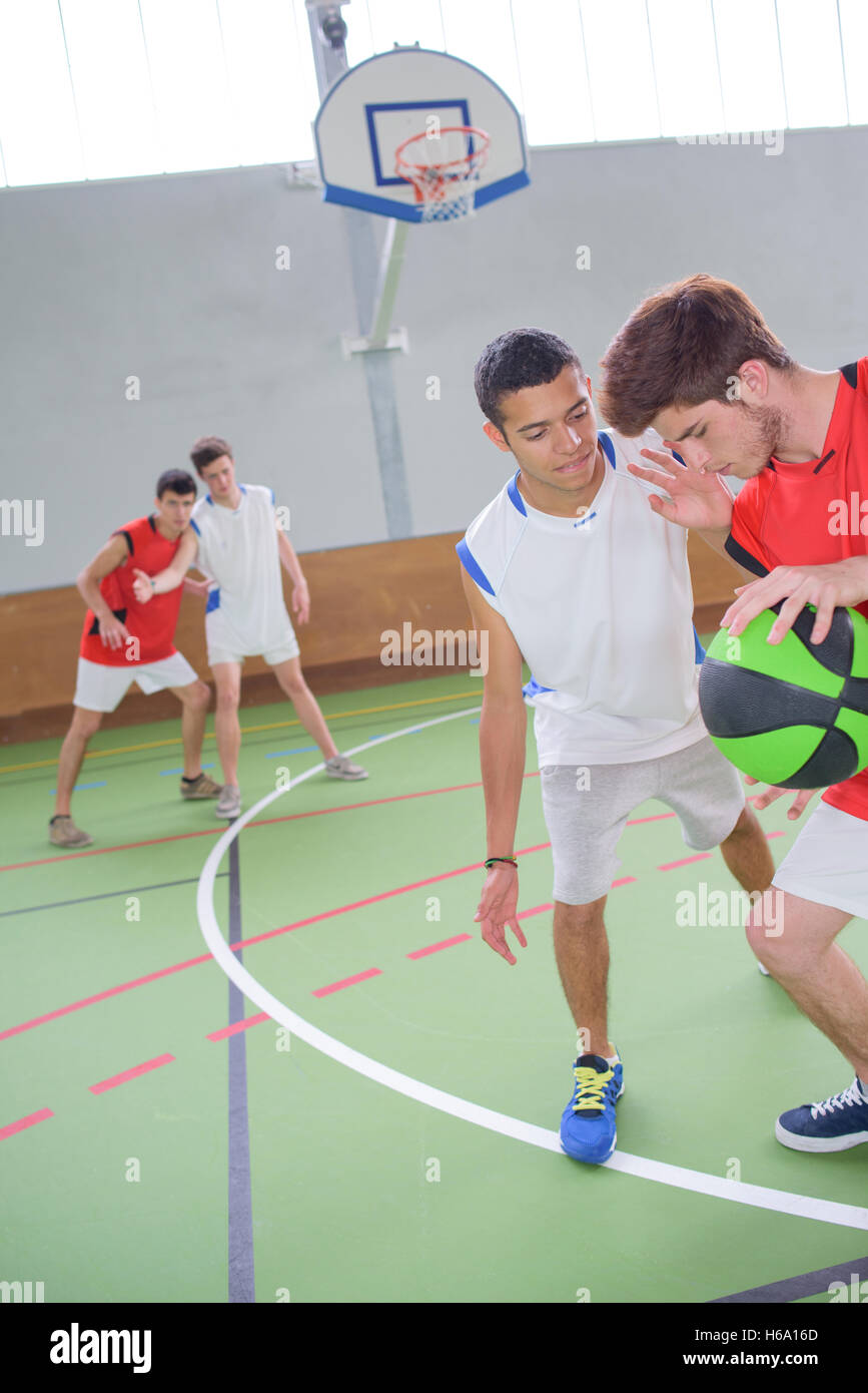 teens playing basketball Stock Photo - Alamy