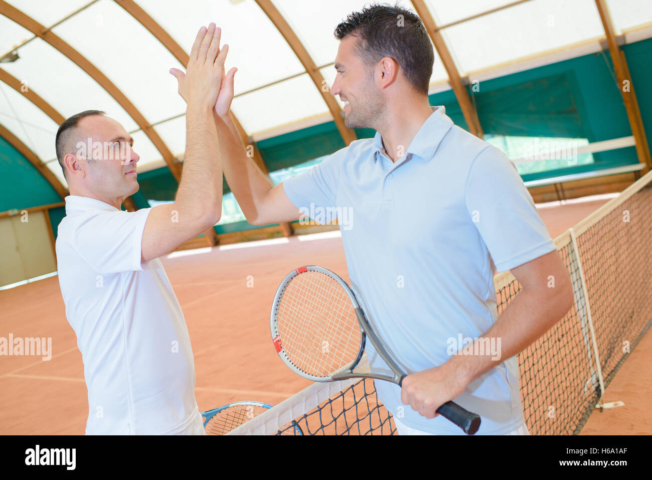 Men doing high five hi-res stock photography and images - Alamy