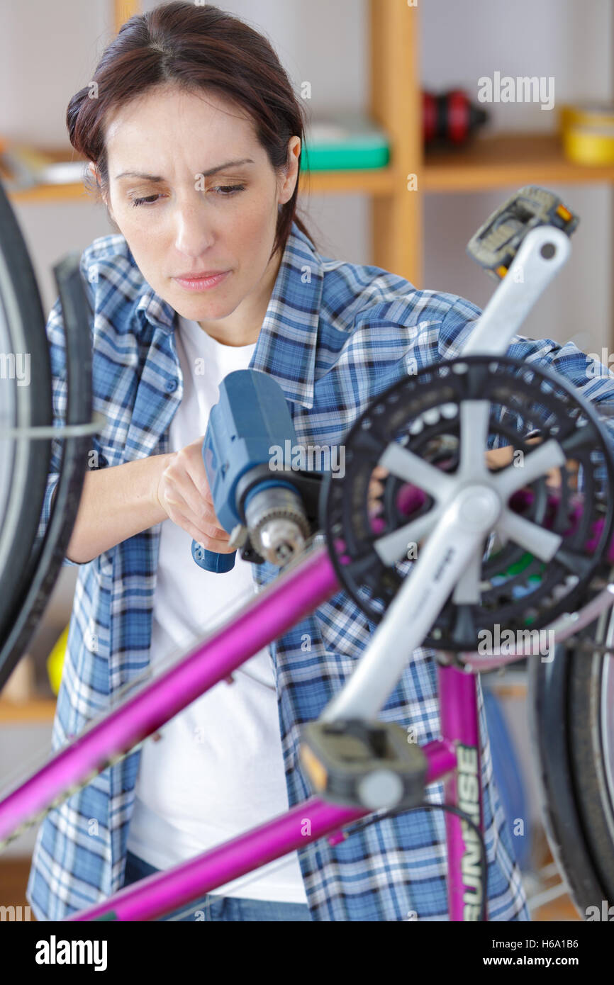 bicycle mechanic repairing a bike in workshop Stock Photo - Alamy