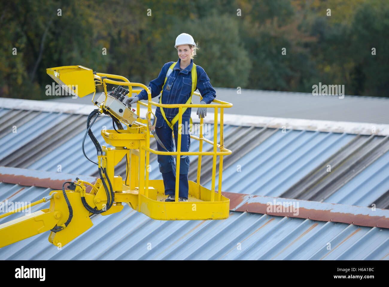 Woman in cherry picker bucket Stock Photo - Alamy