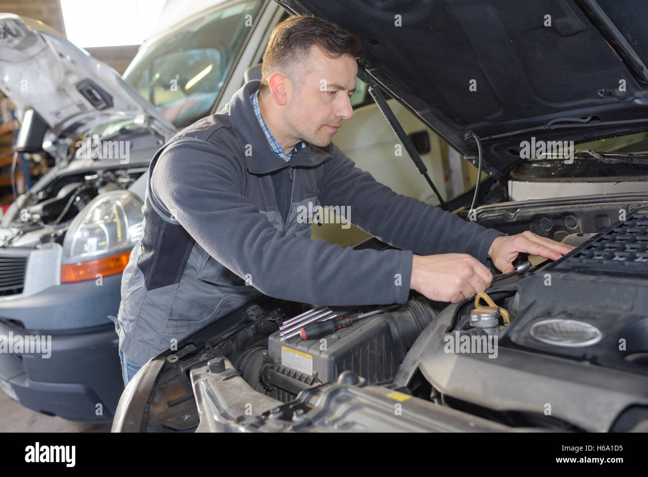 Mechanic using electronic diagnostic hi-res stock photography and ...