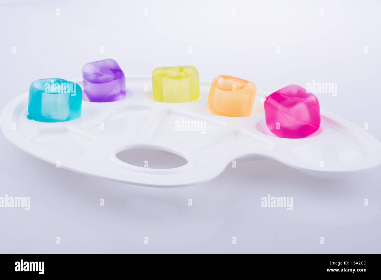 Fake colorful ice cubes on a painting palette Stock Photo - Alamy