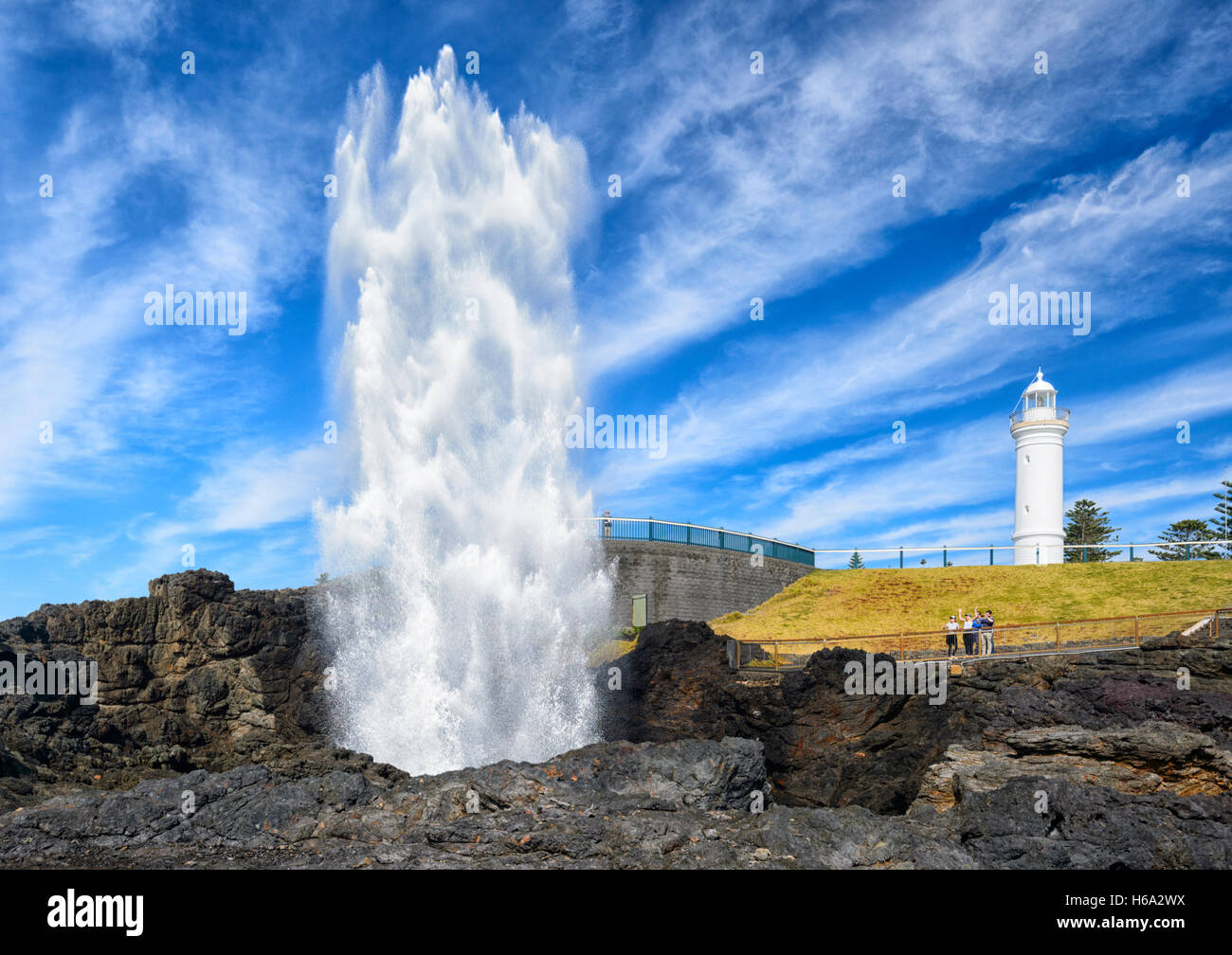 View of the Blow Hole gushing in front of Kiama Harbour Light, Kiama ...