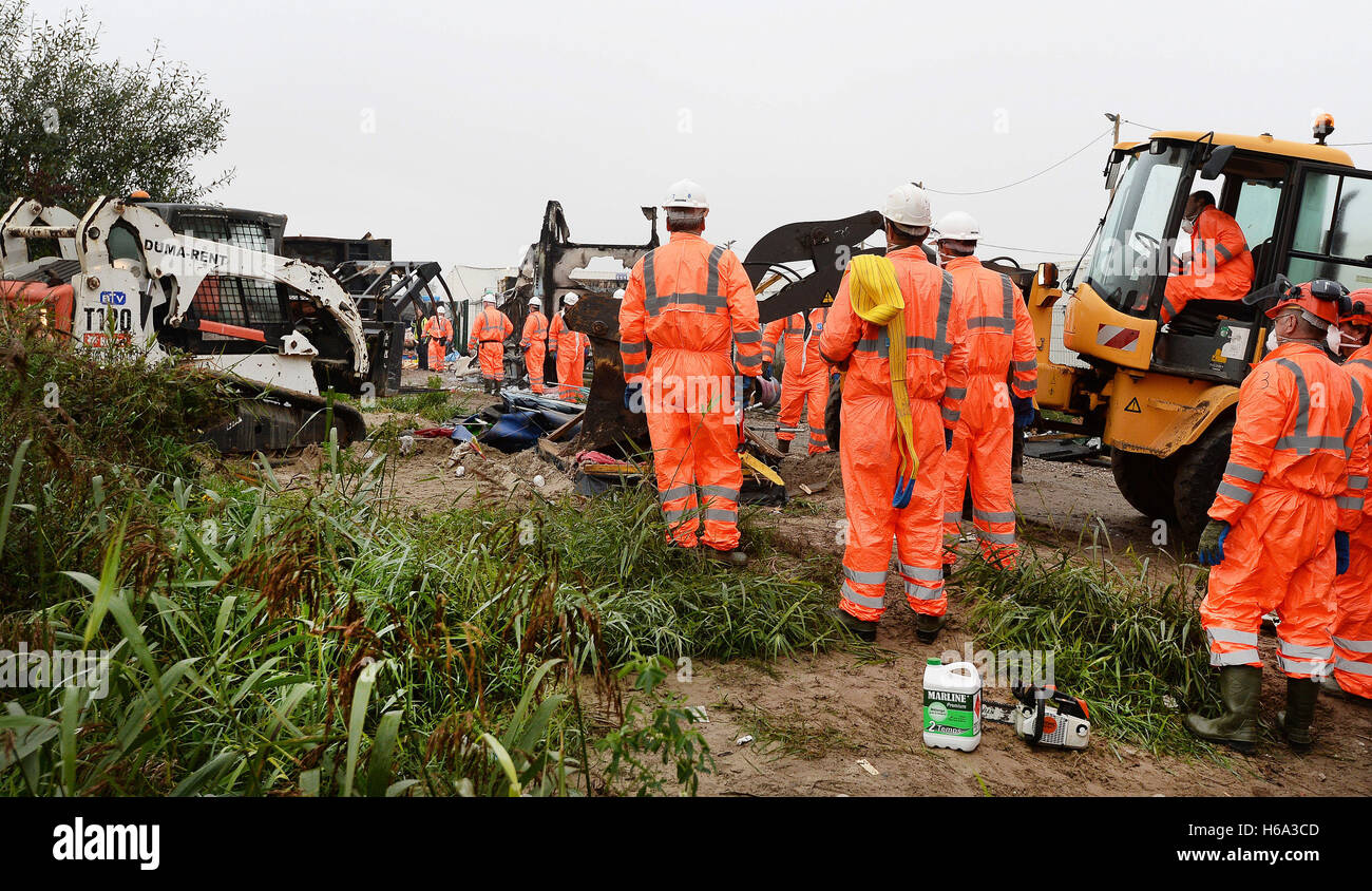 A large crew of demolition workers start breaking down living areas of ...