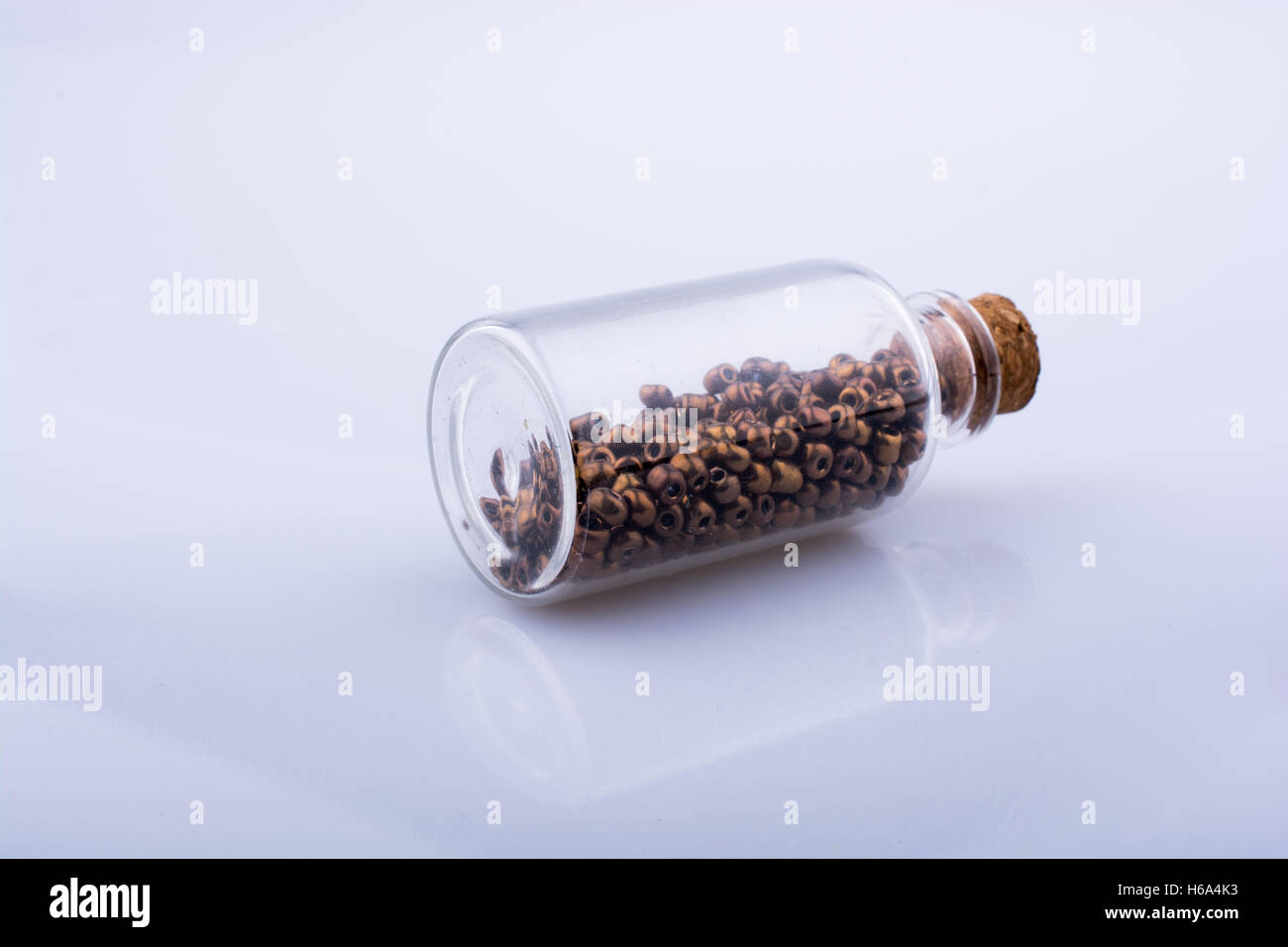Little perfume glass bottle on a white background Stock Photo - Alamy