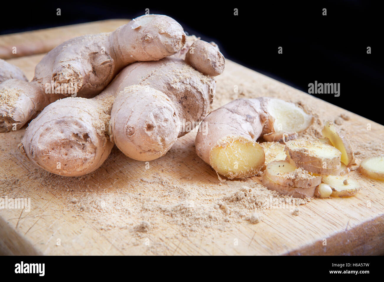 Close up of different forms of ginger against a wood worktop Stock ...