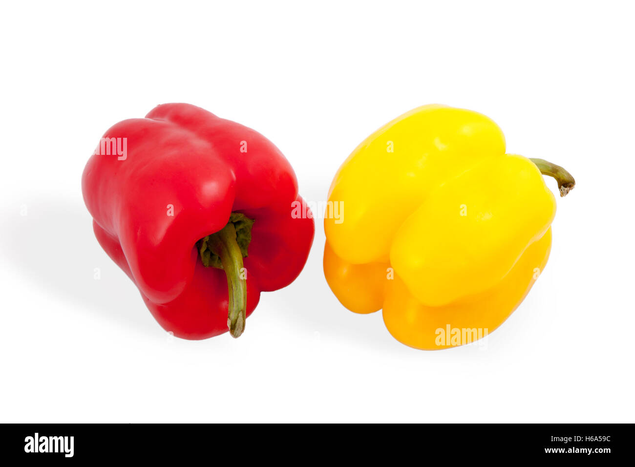 red and yellow peppers isolated on white background Stock Photo - Alamy