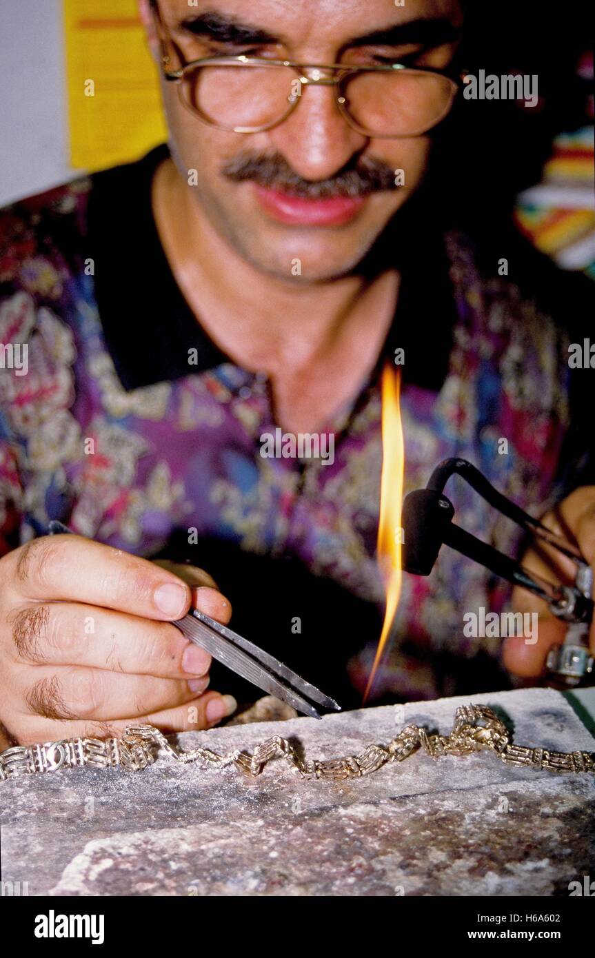 Armenian goldsmith Armen Sarkassian busy in his Damascus workshop ...
