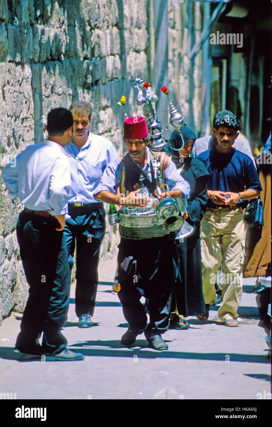 A vendor of juice and so-called "Araq Sous", a drink made from wild ...