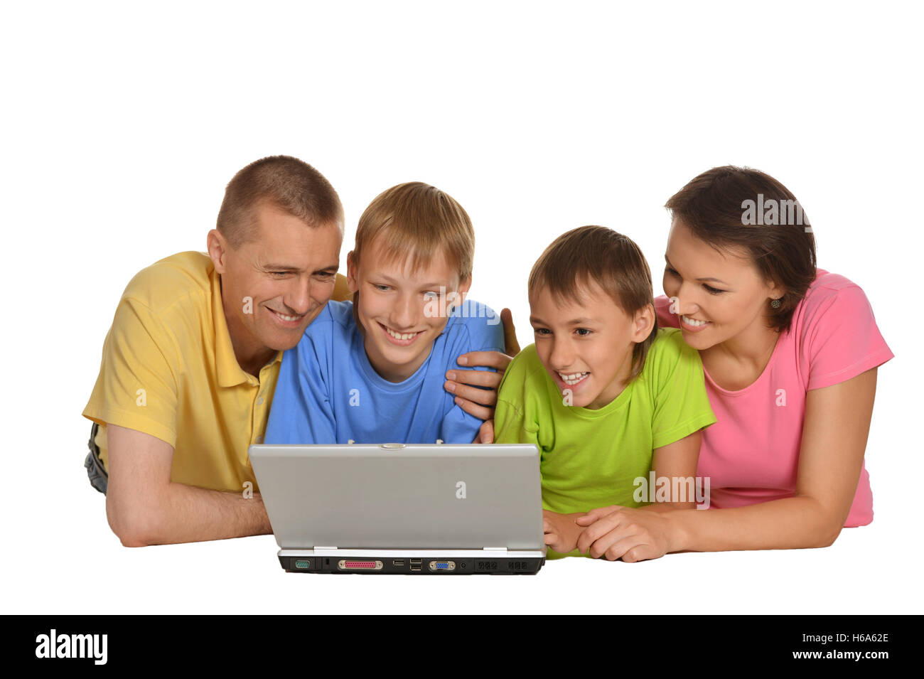 Happy family with laptop Stock Photo - Alamy