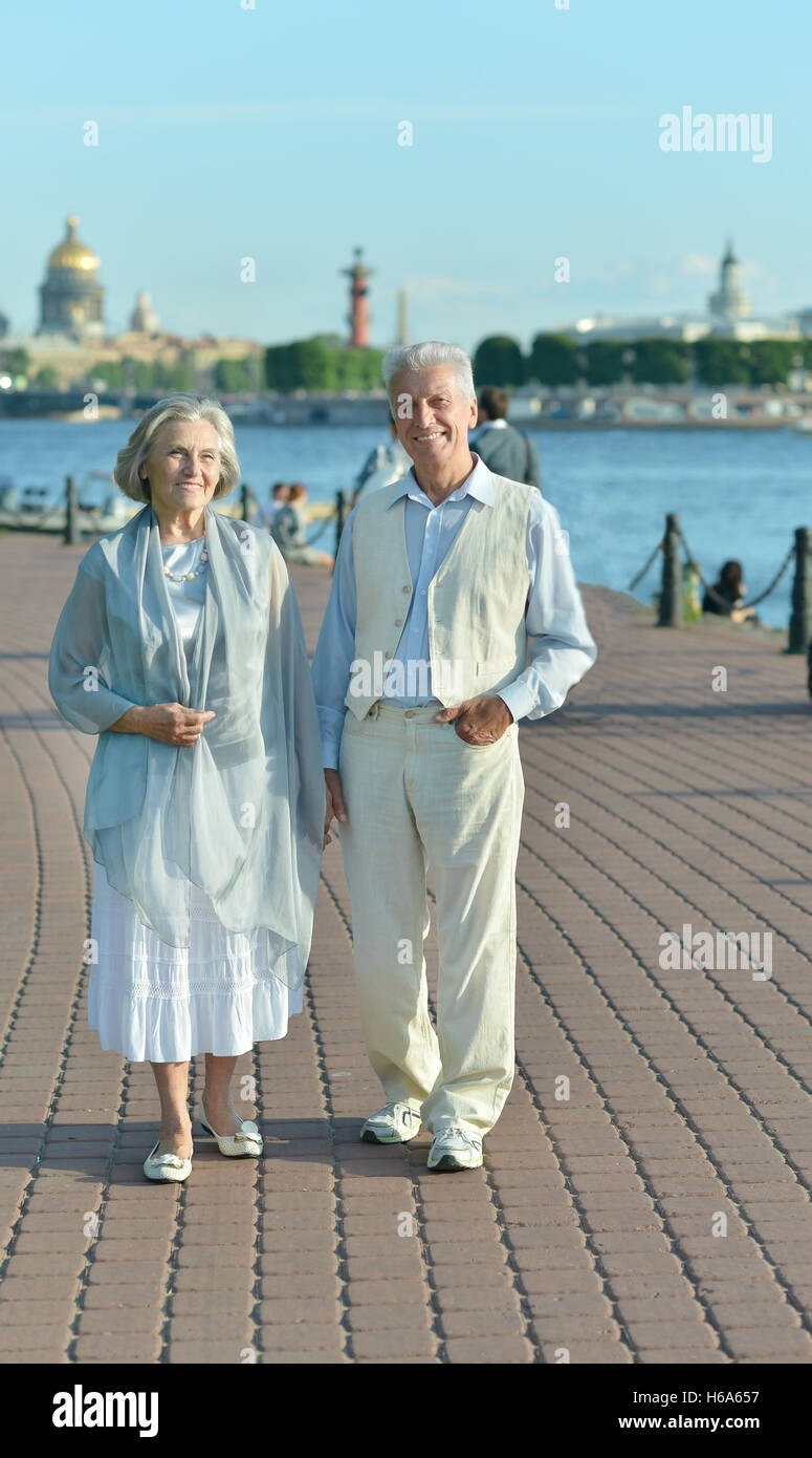Elderly couple having rest in park Stock Photo - Alamy
