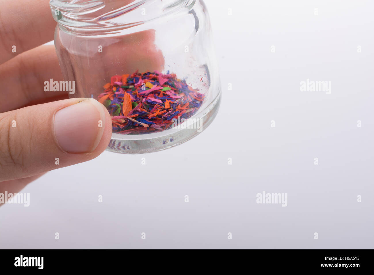 Little perfume glass bottle in hand on a white background Stock Photo ...