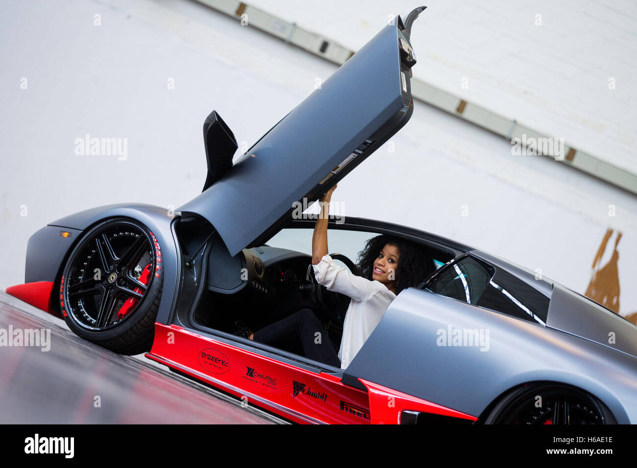 Essen, Germany. 26th Oct, 2016. The model Luisa sits in a Lamborghini ...