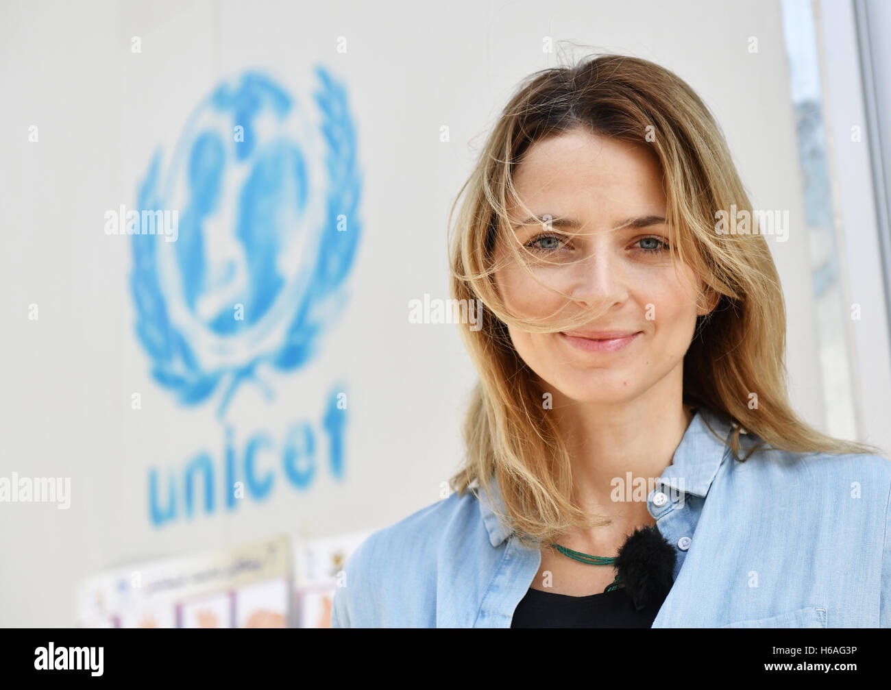 EXCLUSIVE - UNICEF ambassador Eva Padberg stands by a UNICEF logo at a ...