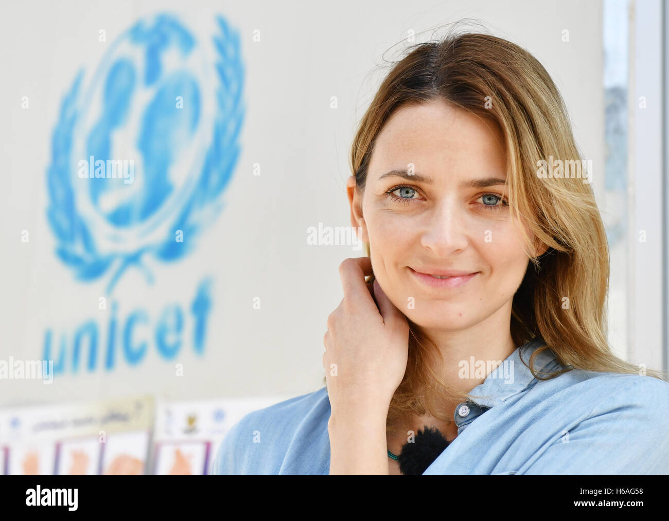 EXCLUSIVE - UNICEF ambassador Eva Padberg stands by a UNICEF logo at a ...