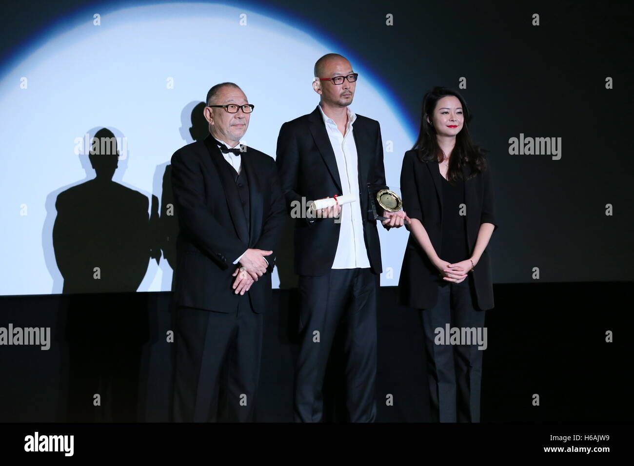 Chinese director Guan Hu (center) attends the ceremony of the 2016 ...