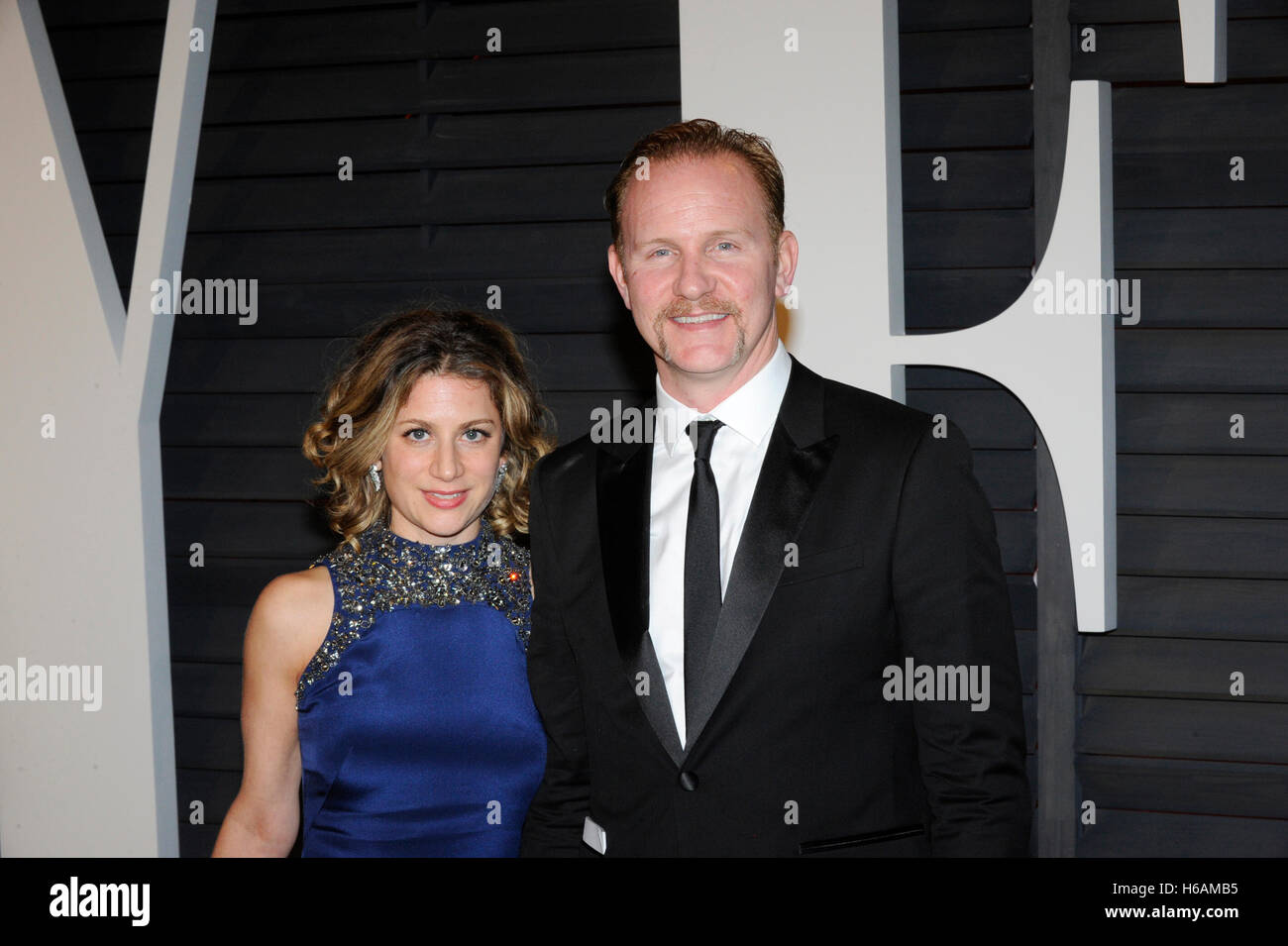 Morgan Spurlock (r) attends the 2015 Vanity Fair Oscar Party hosted by ...